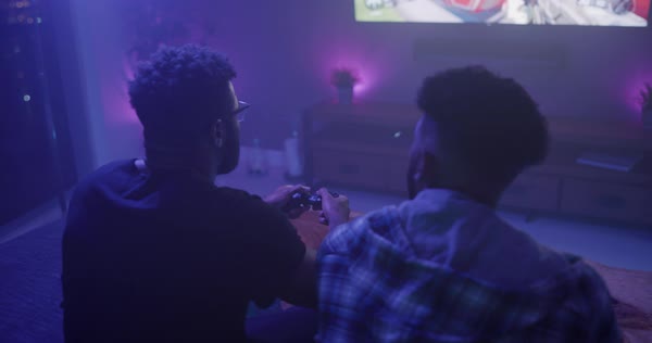 Freinds playing video games at night in apartment - 4K Royalty-free ...