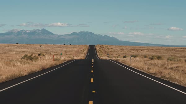 Driving on highway of black asphalt and yellow lines at sunny day, road ...