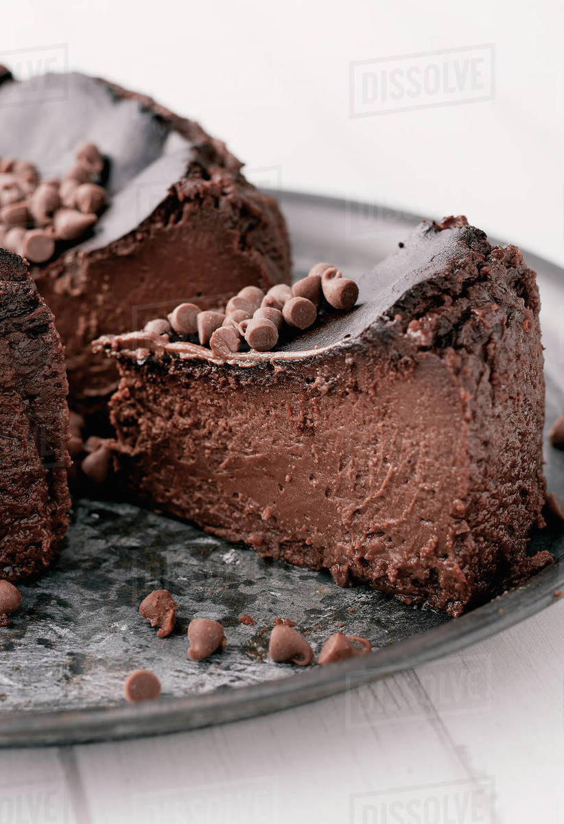 A piece of a chocolate basque burnt cheesecake close up - Royalty-free ...
