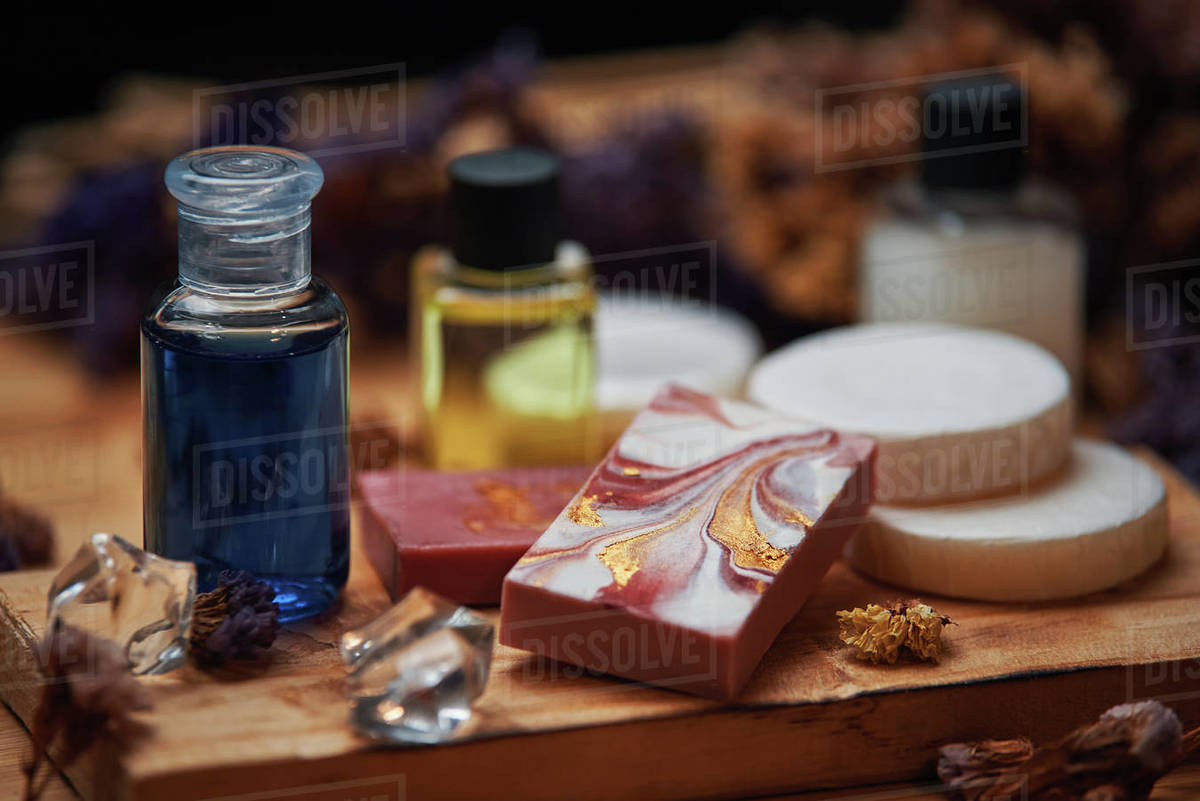 Shampoo and soap products on wooden board - Stock Photo - Dissolve