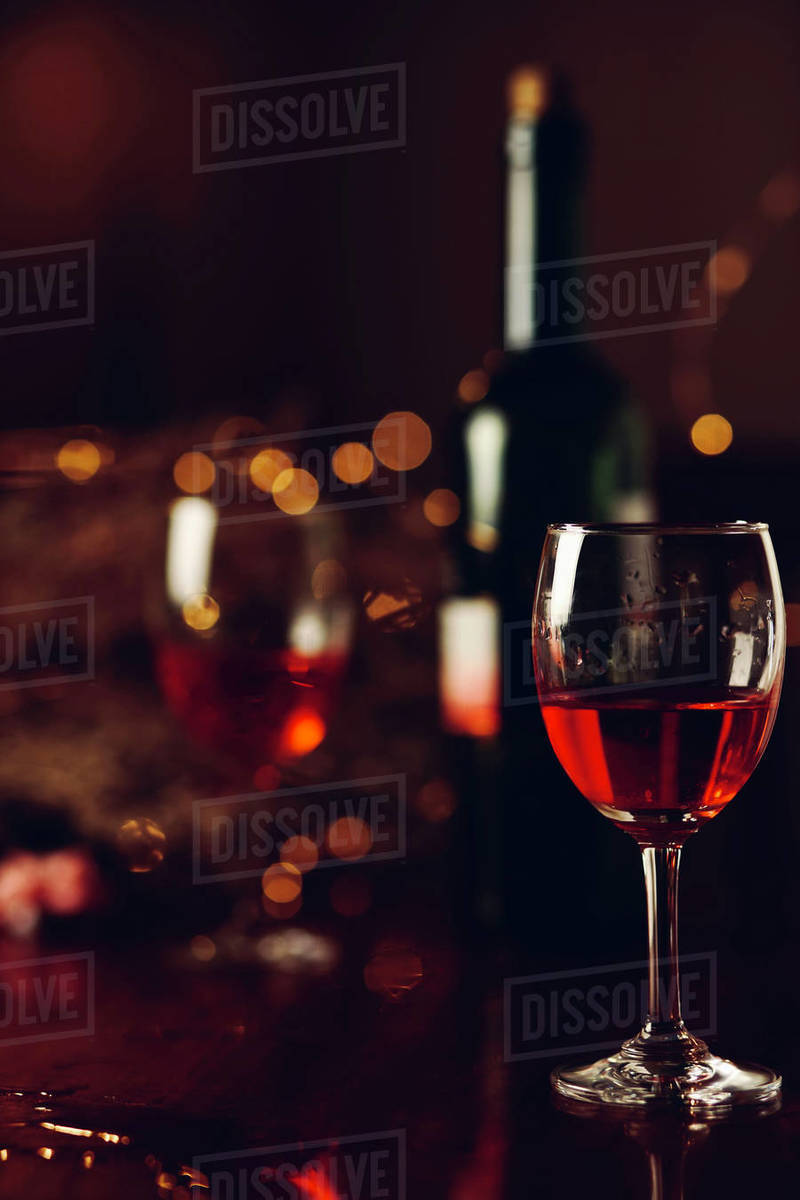 Wine glass in the night scene - Stock Photo - Dissolve