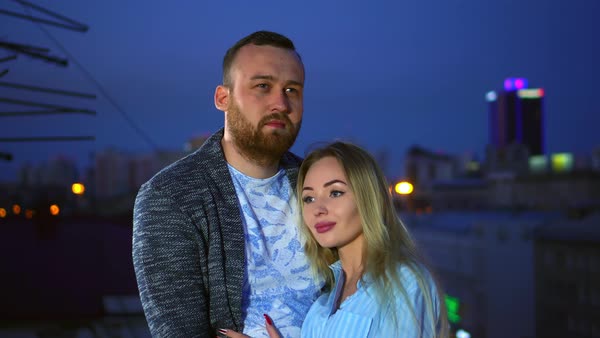 Loving couple tenderly hug on background city lights closeup enjoy ...