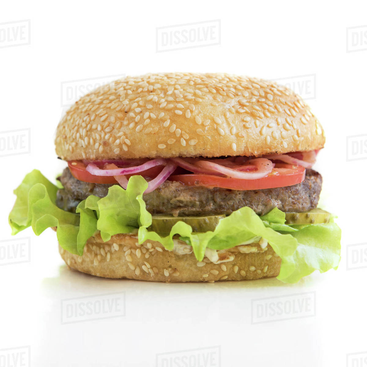 Tasty classical burger with meat cheese lettuce onion, tomato isolated ...