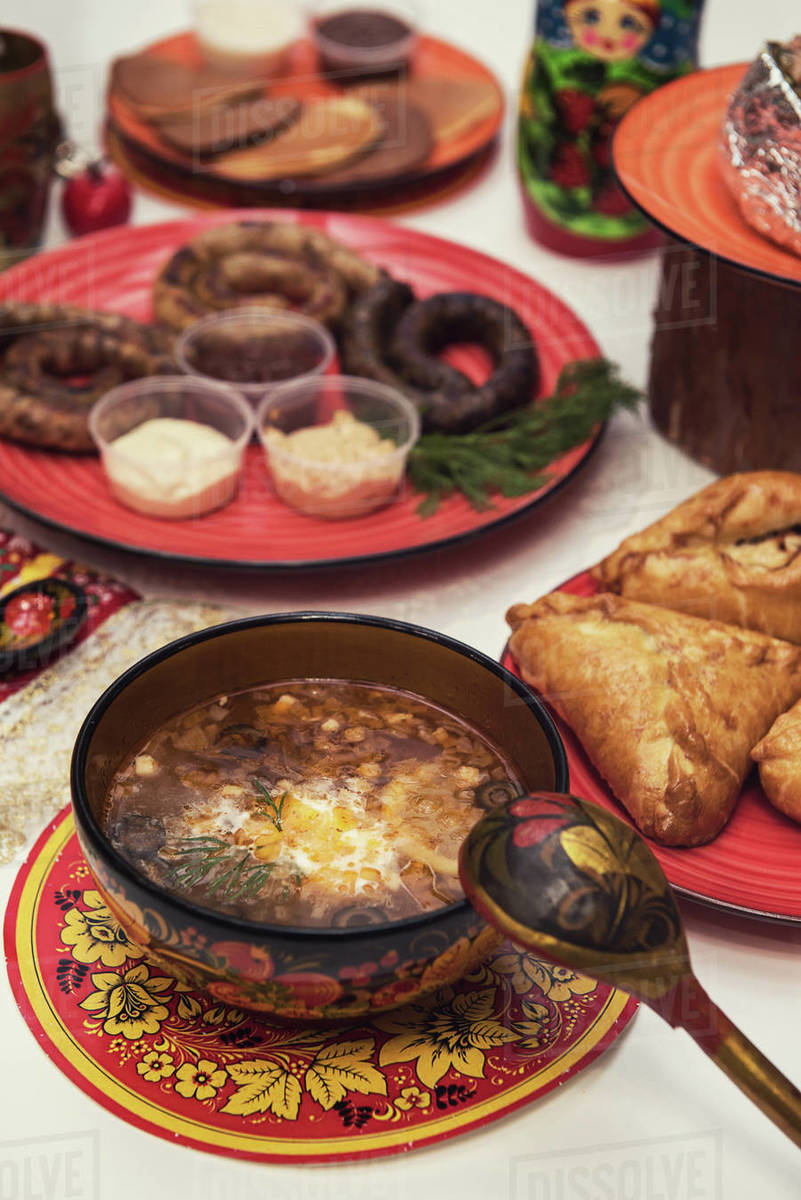 Table with traditional russian food decorated in russian style ...