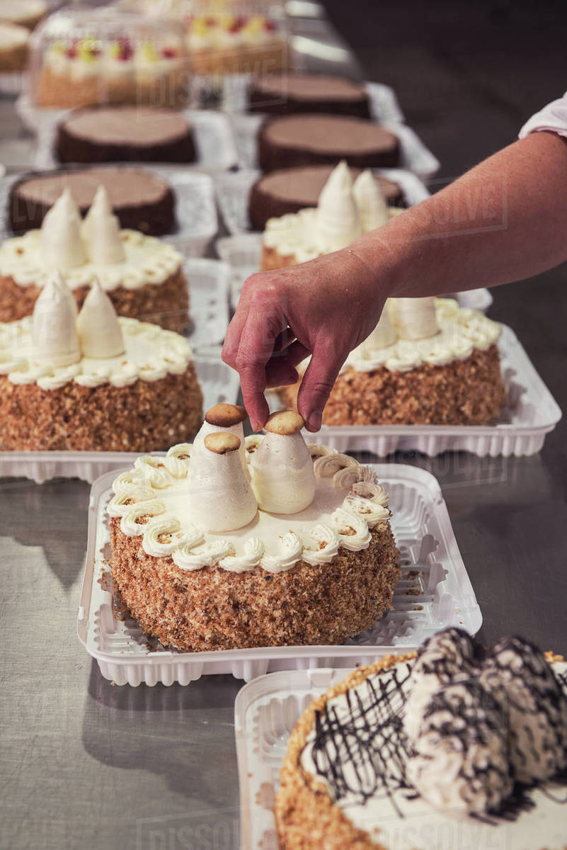 Manual cakes production on factory - Royalty-free Stock Photo | Dissolve