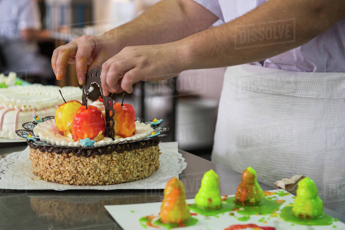 Manual cakes production on factory - Royalty-free Stock Photo | Dissolve