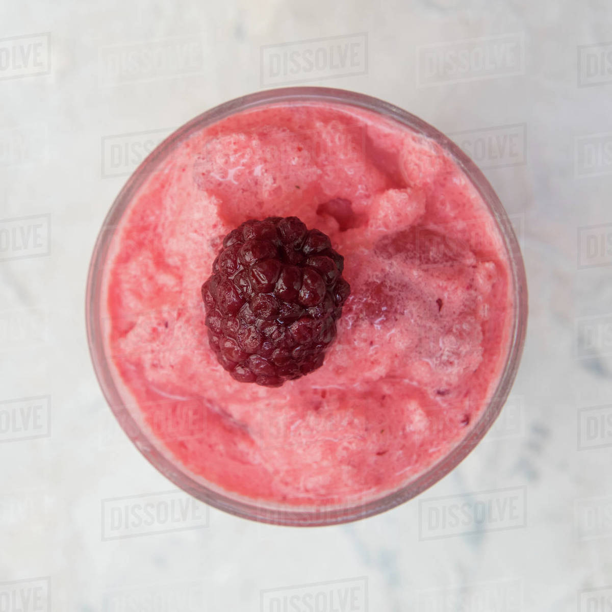 Blackberry smoothie on a white concrete background. Square cropping ...