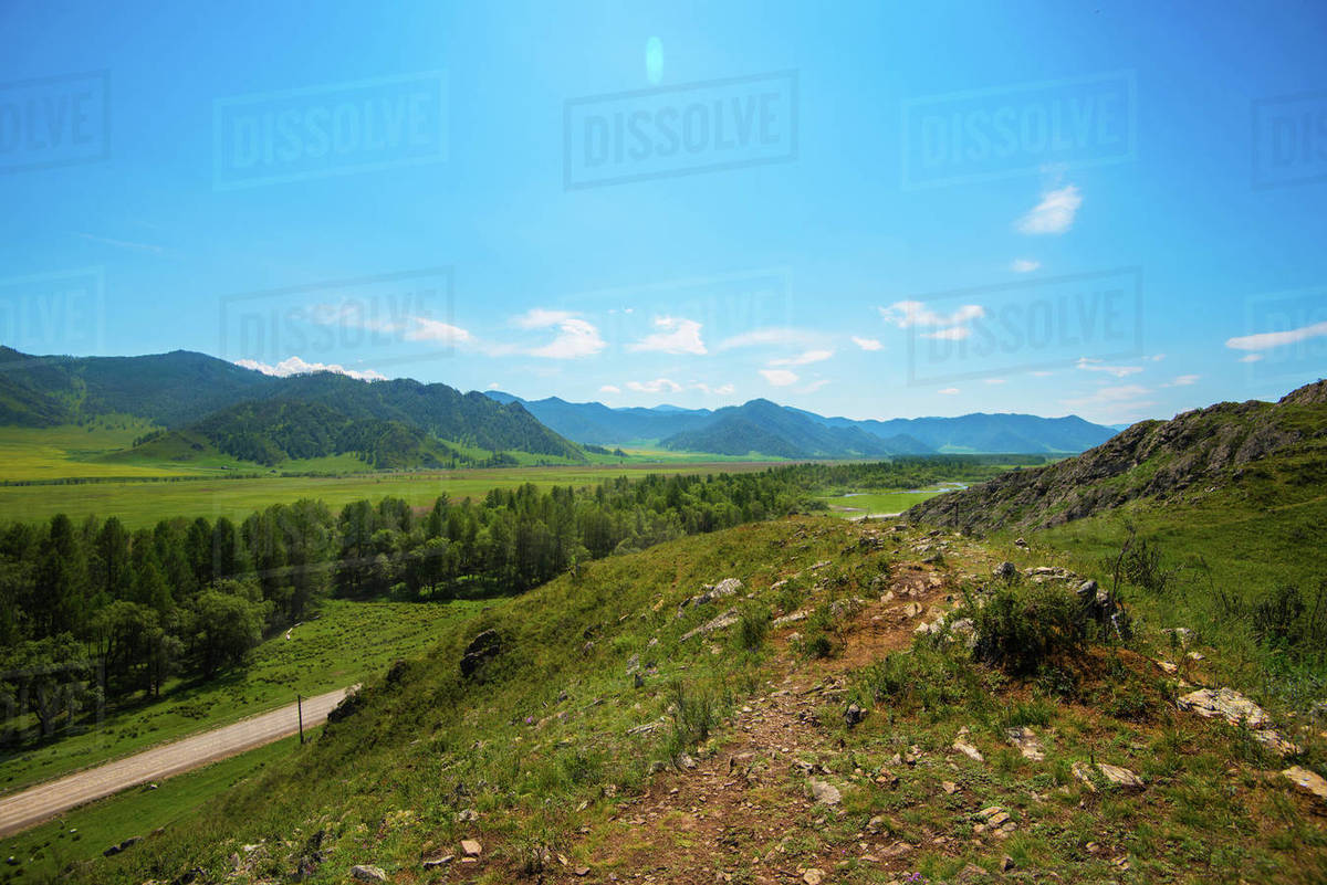 Rural road in mountains in Karakol valley, Altay, Siberia, Russia ...