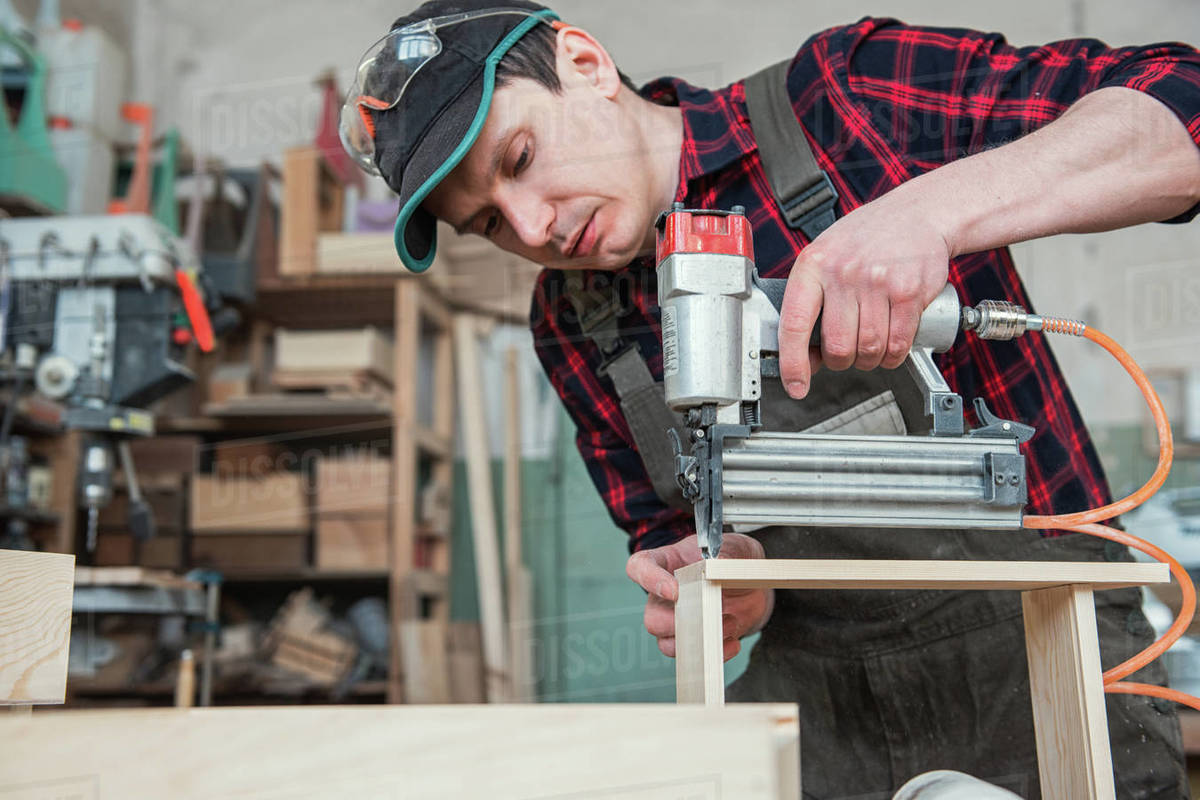 Worker making the wood box. Profession, carpentry and woodwork concept ...