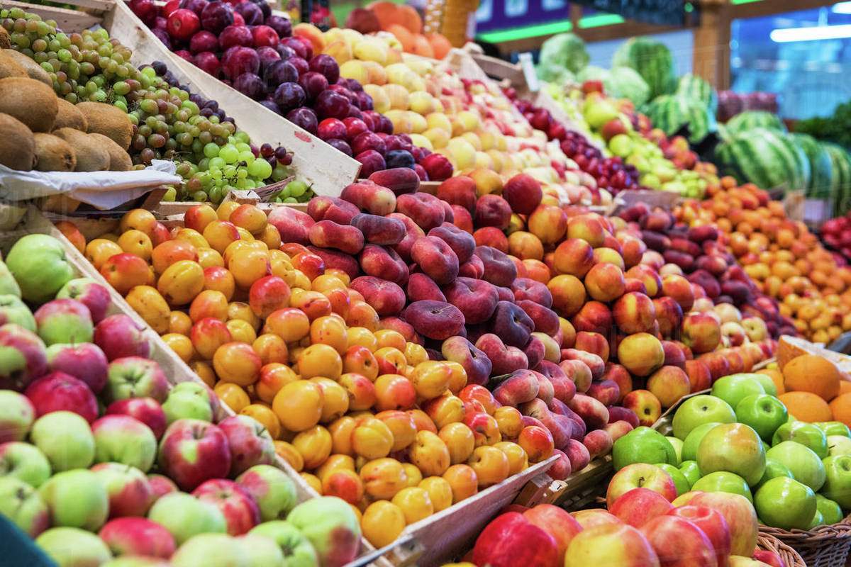 Assortment of fresh fruits at the market - Stock Photo - Dissolve