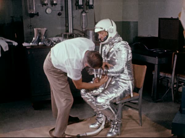 Astronaut Walter M Schirra being fitted for his spacesuit for the ...