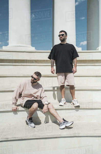 Two guys in trendy clothes on the street - Royalty-free Stock Photo ...