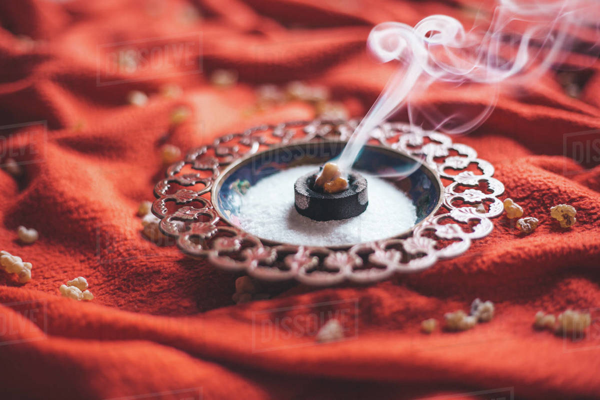 Frankincense burning on a hot coal. Frankincense is an aromatic resin ...