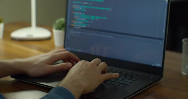 Close up hands engineers developing software app using digital laptop ...