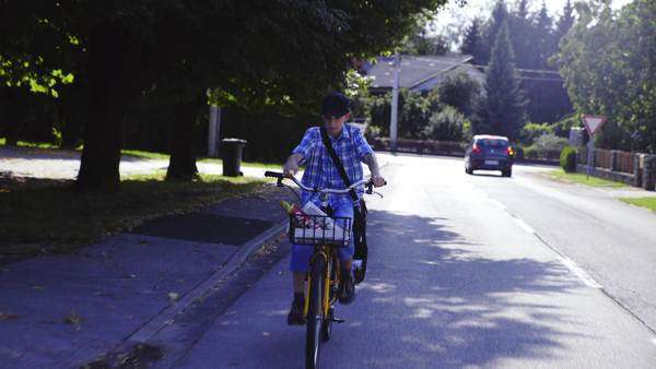 Boy mailman on bicycle throwing newspaper - 4K Royalty-free Stock Video ...