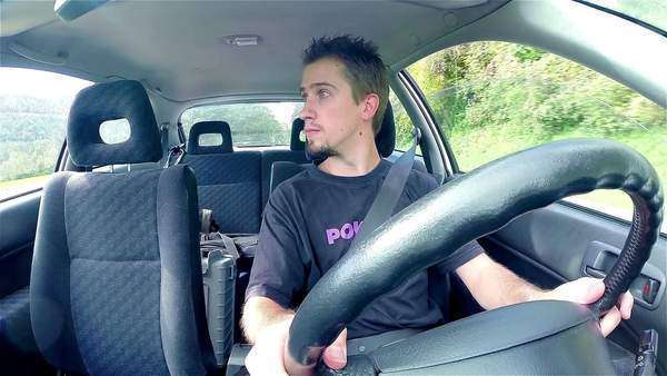 Fisheye lens of man driving car front view slow motion. Portrait shot ...