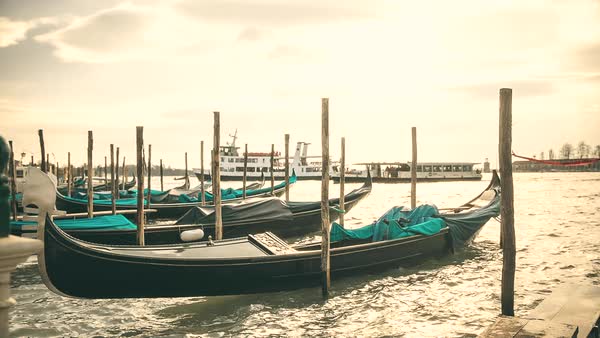Venice gondola on the turbulent sea. Static wide shot of gondola in ...