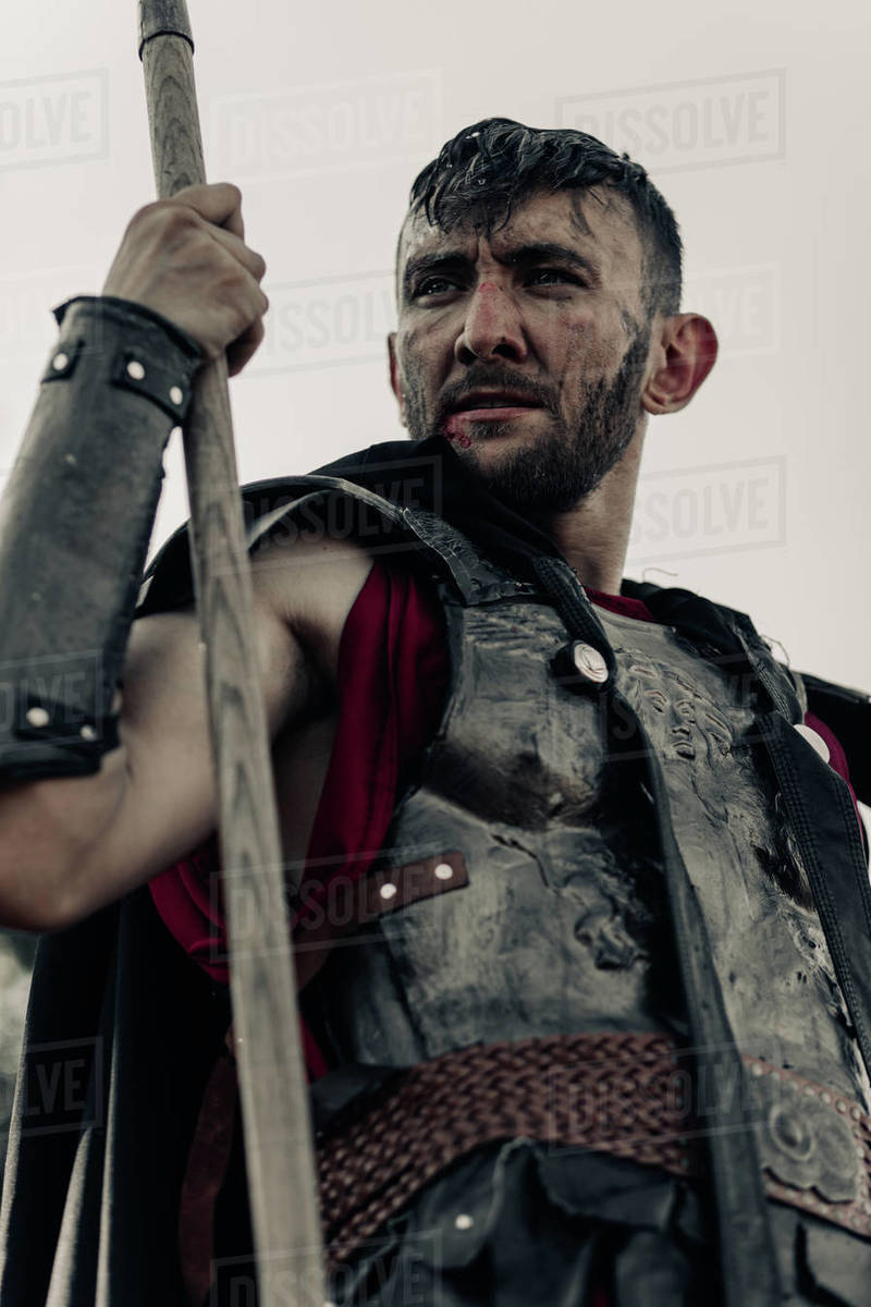 Portrait of ancient Spartan warrior in armor with spear in his hand ...