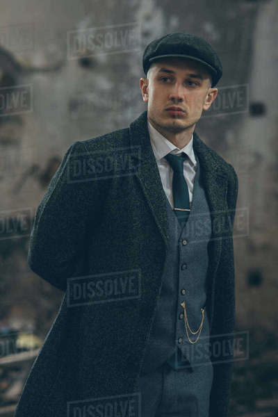 A man posing in the image of an English retro gangster of the 1920s ...