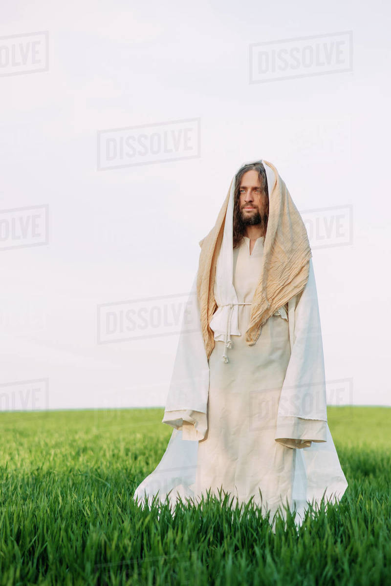 Prophet standing in meadow clothed in his traditional white robe ...