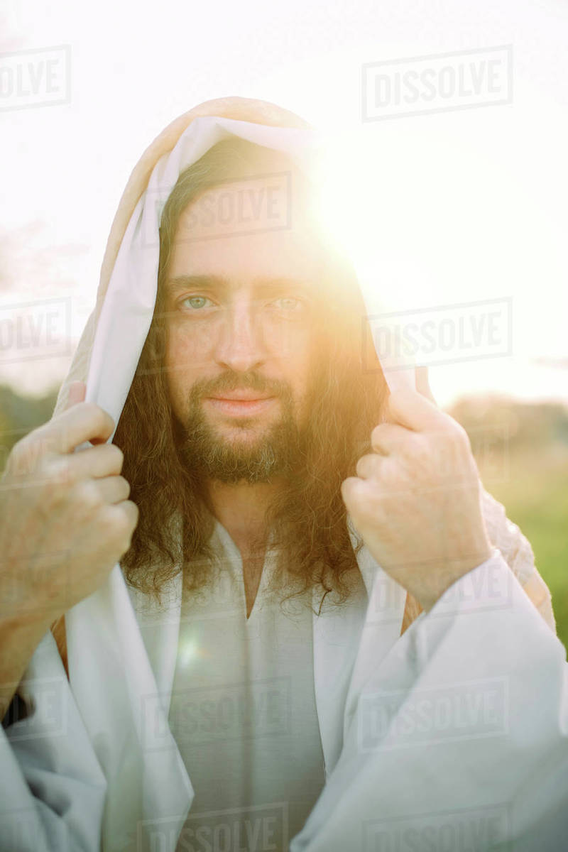 Prophet standing in meadow clothed in his traditional white robe ...