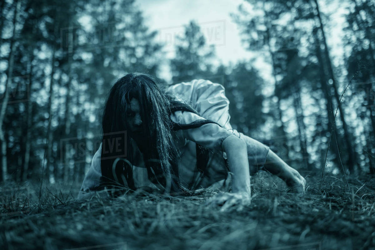 Girl with long black hair in image of scary ghost zombie crawls on ...