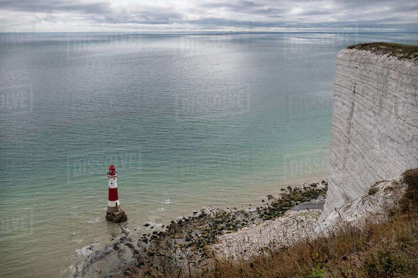Beachy Head lighthouse and the white cliffs in Sussex - Royalty-free ...