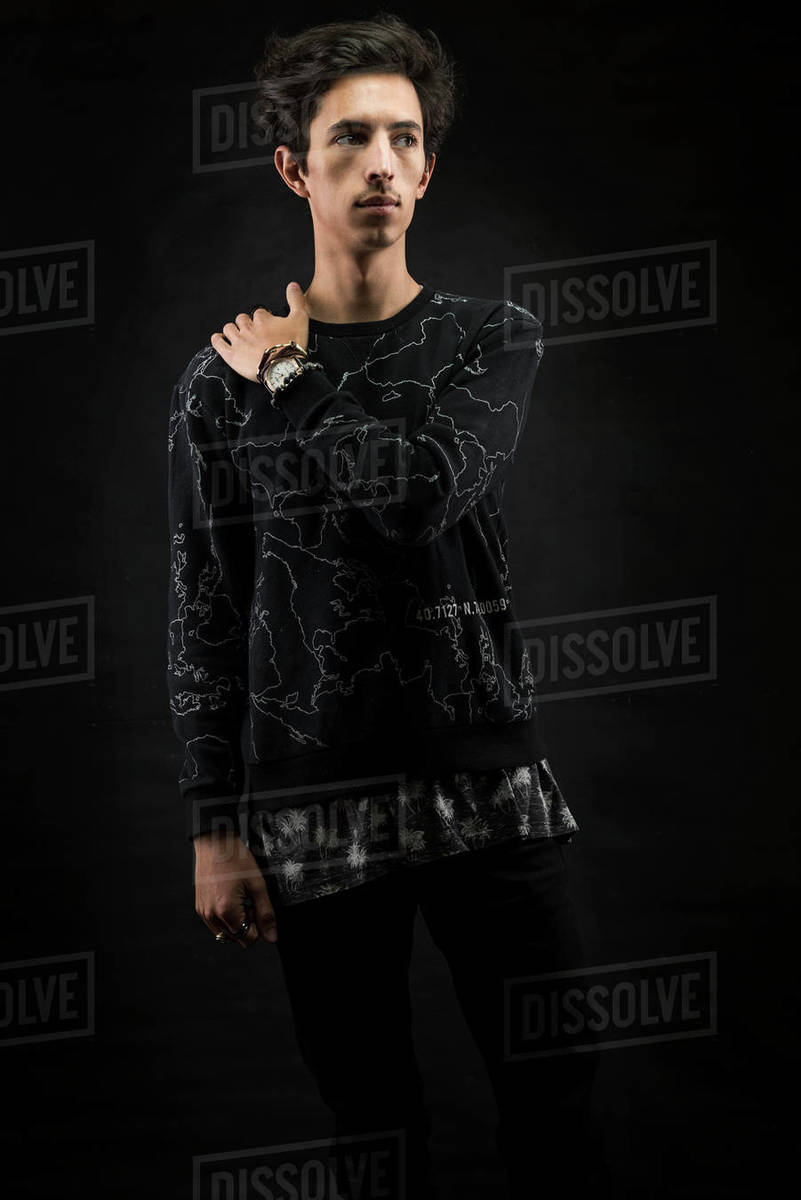 Caucasian male model with hands on shoulder in studio - Royalty-free ...