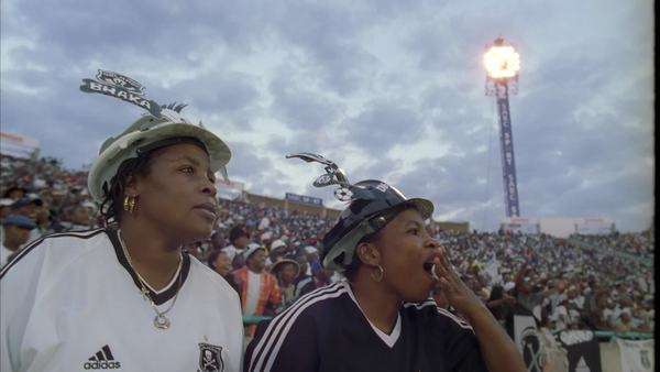 Close up of two Orlando Pirates female fans cheering on their team with ...