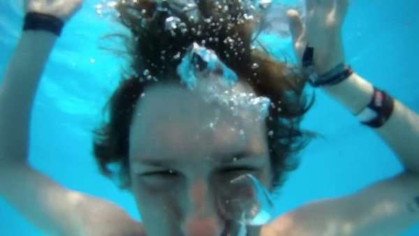 Talking under the water. - Stock Video Footage - Dissolve
