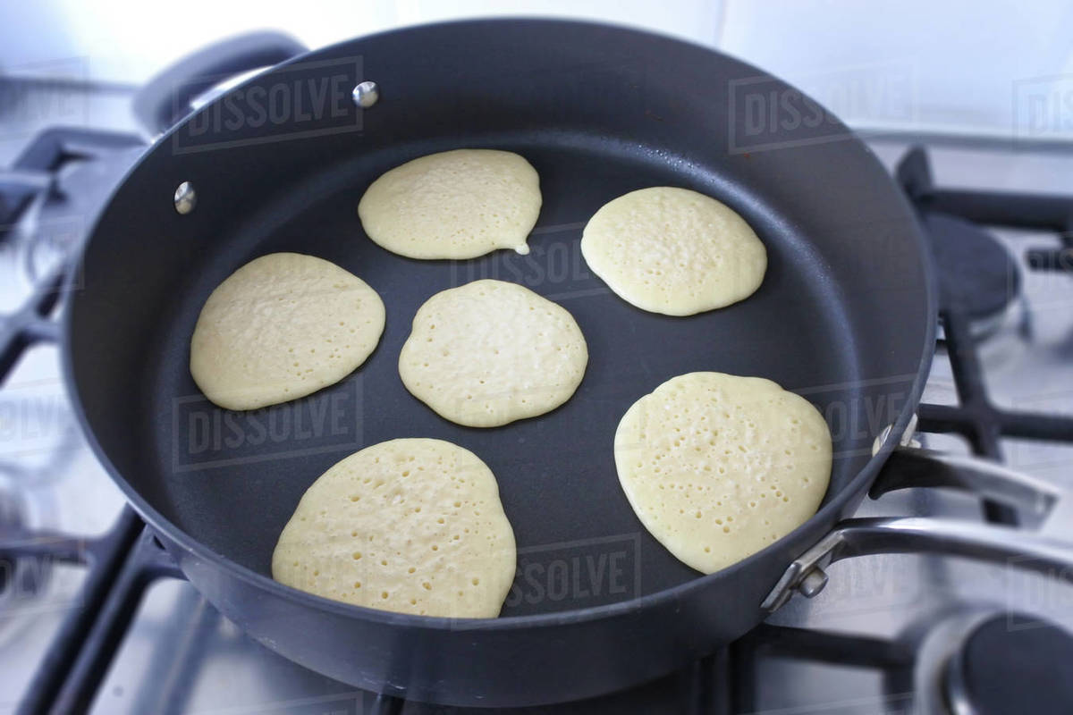 Frying Pikelets in a fry pan on a stove. - Royalty-free Stock Photo ...