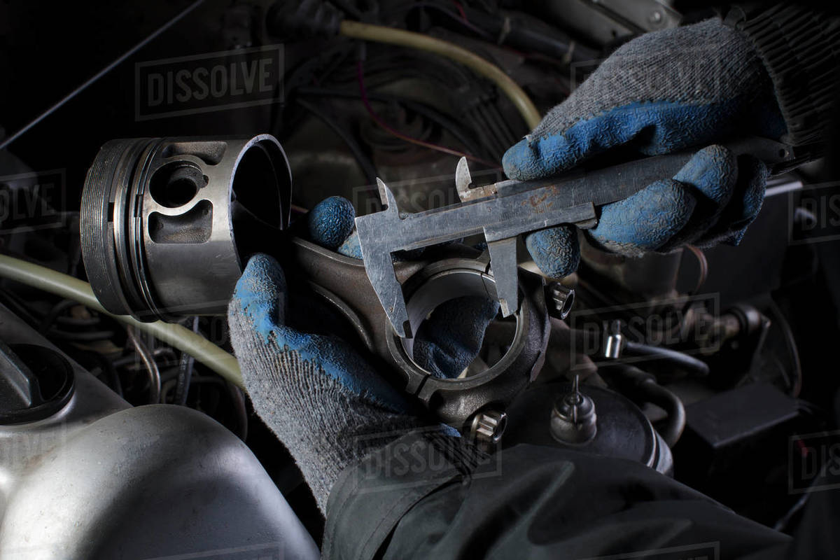 Car engine maintenance. Engine piston system repair. Hands with a ...