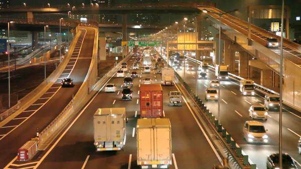 Vehicles running Bayshore route at night - Stock Video Footage - Dissolve