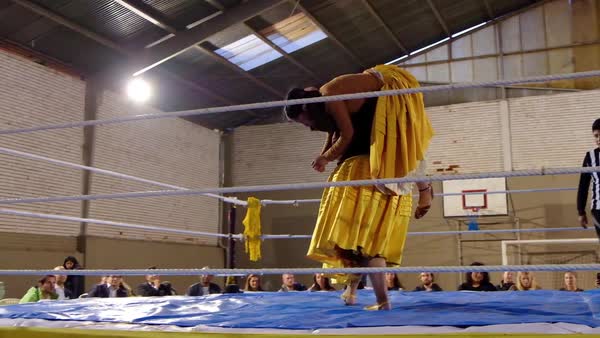 Female woman cholita wrestlers in native costume fight in a boxing ring ...
