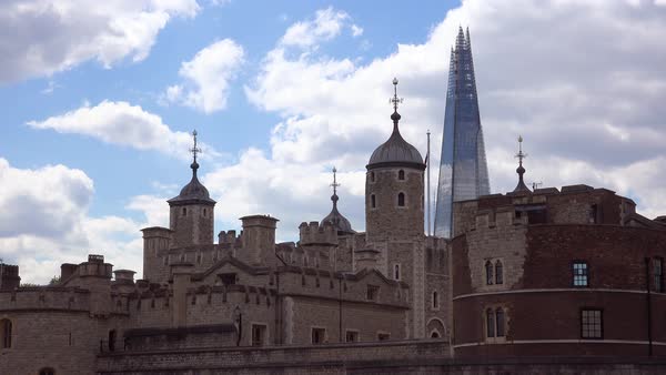 The Shard skyscraper behind the Tower of London, a contrast of ...
