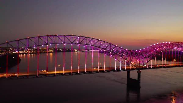 Good panning evening night aerial of Memphis Hernando De Soto Bridge ...