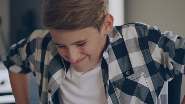 Strong teen boy trying get up from wheelchair, upset with failure ...