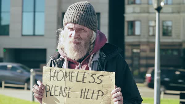 Sad elderly male holding homeless please help sign, socially vulnerable ...