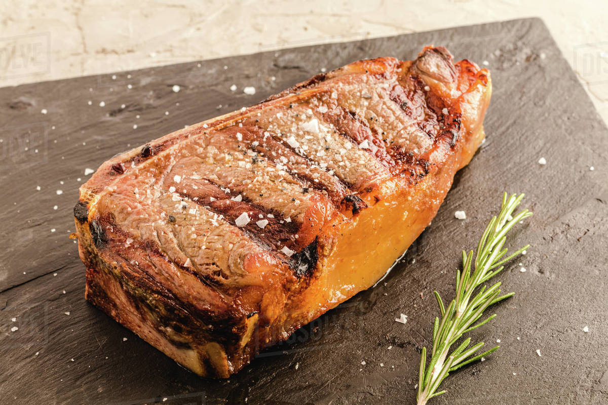 Cooked aged beef. Chuleton rubia gallega - Royalty-free Stock Photo ...