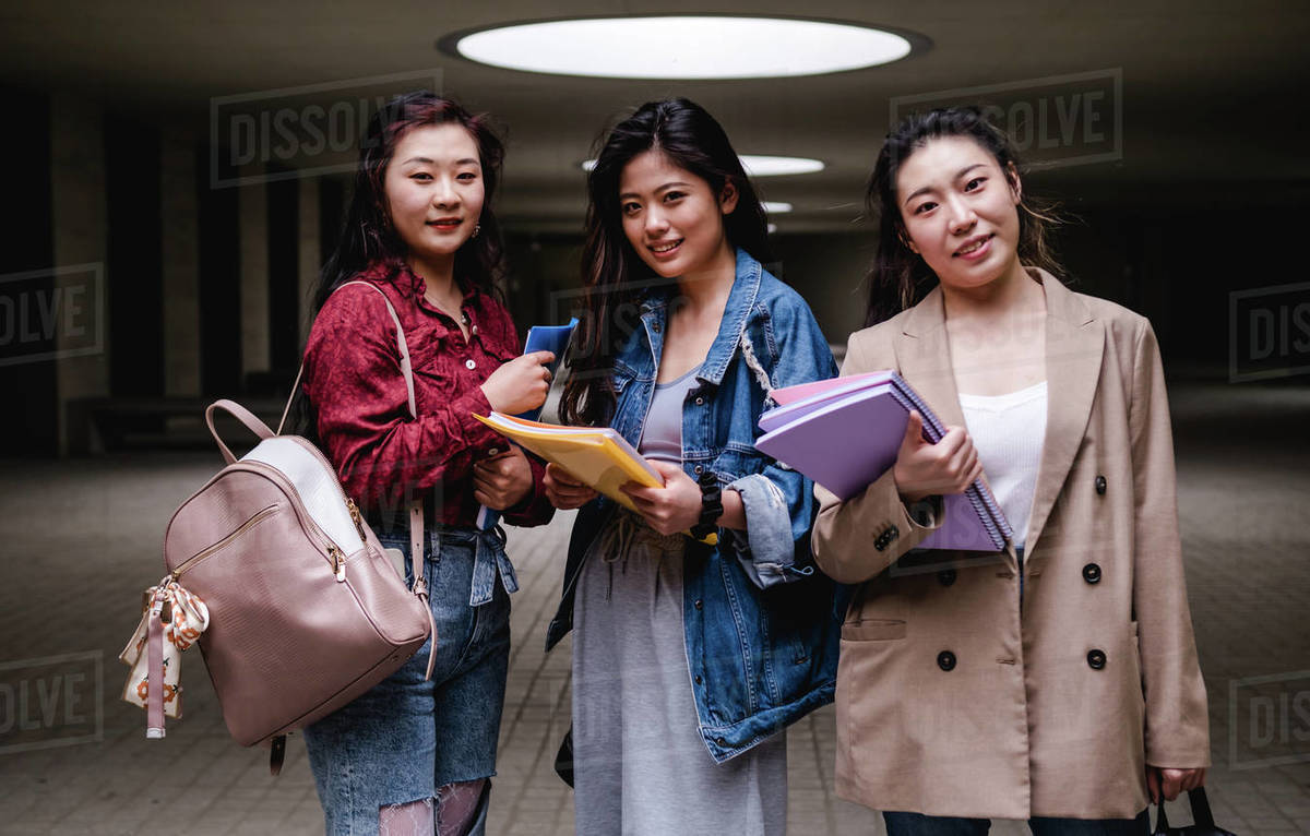 a group of girls enjoying time together in college campus. - Royalty ...