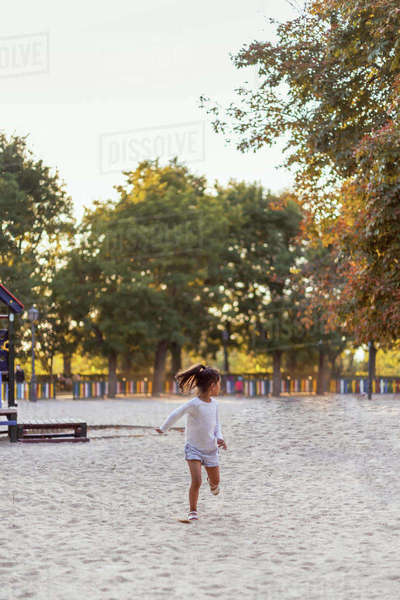 Vertical shot of a child playing in the park. - Royalty-free Stock ...