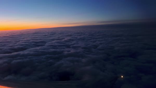 Cinematic sunrise cloudscape heaven landscape jet wing flying panorama ...