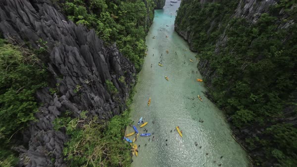 FPV sports drone dive shot people tourist floating boats swimming ...