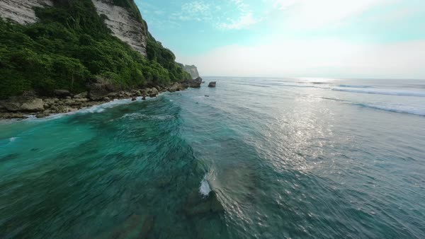 Sea beach cliff stone cinematic sand coast paradise island lagoon sky ...