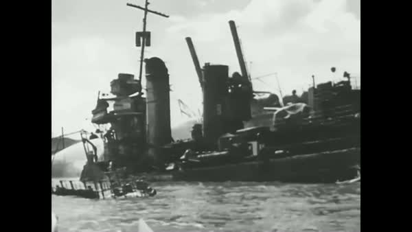 1941 - Salvage crews inspect the USS Oklahoma and Utah after the Pearl ...