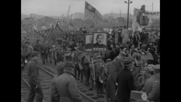 1954 - Chinese POW’s walk through a crowd and get into a truck during ...