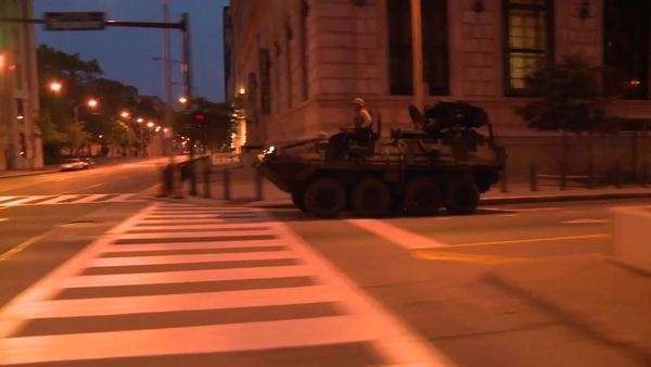 Police and Marines roll out tanks and armored vehicles through an ...