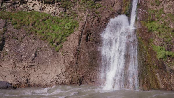 Water falling into the river. - 4K Royalty-free Stock Video Footage ...