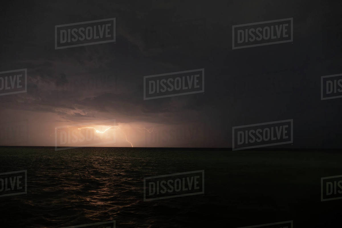 Lightning over water. Electric discharge. Nature background for design ...