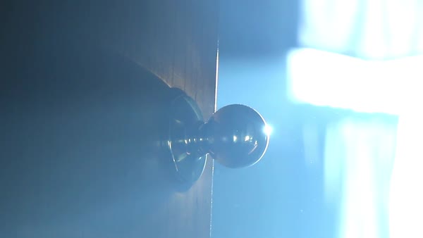 Dust motes glimmer in a powerful beam of sun coming through a window ...